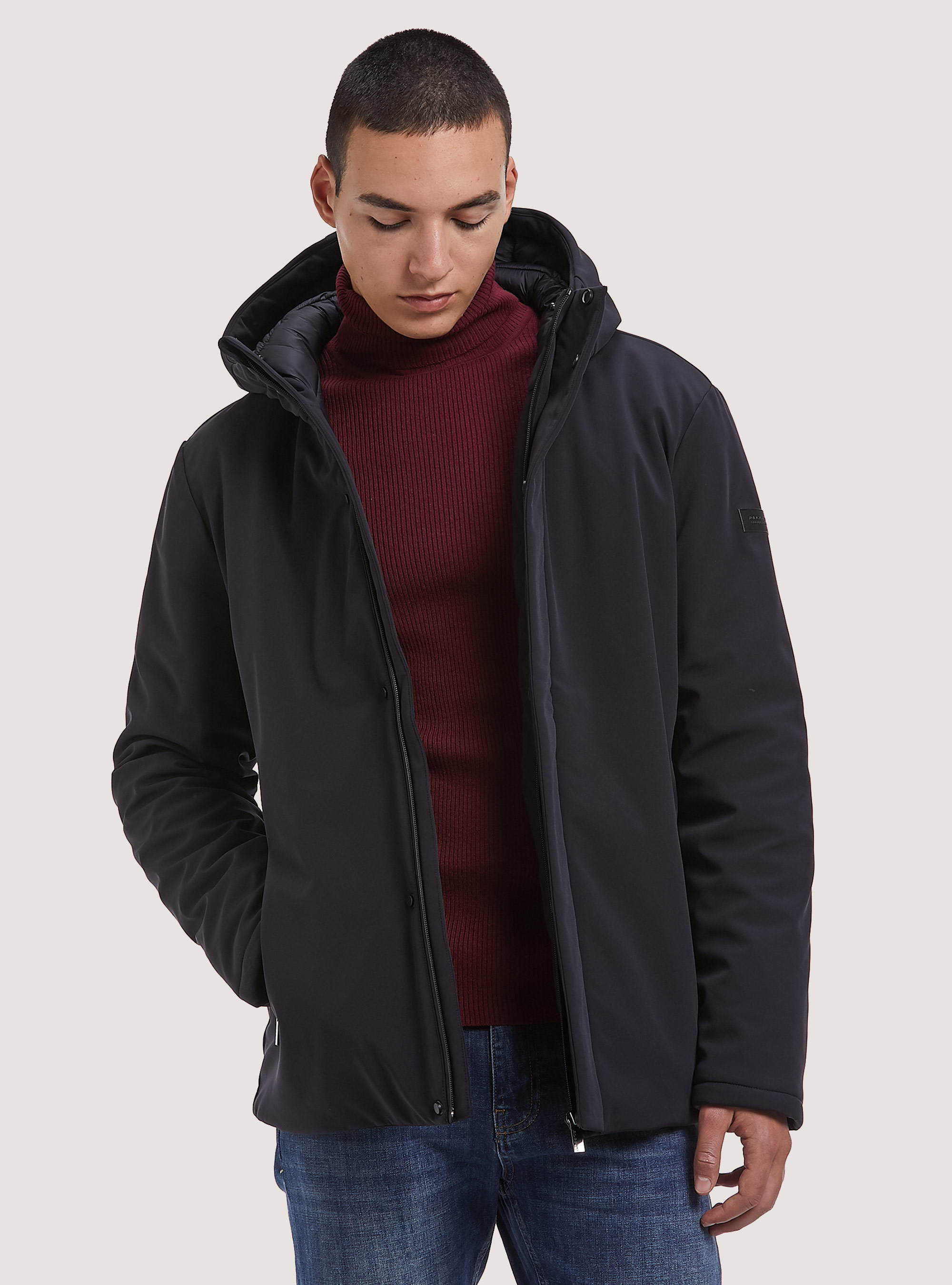 Technical fabric jacket with recycled padding