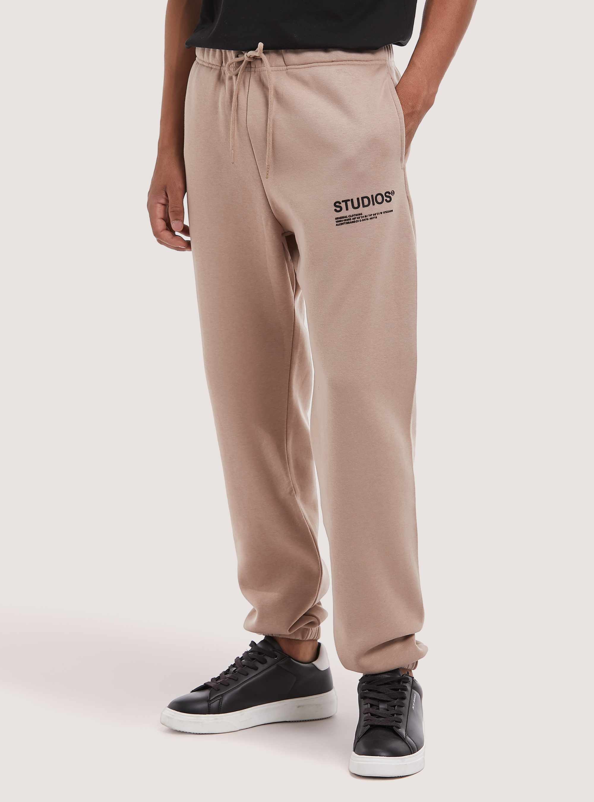Pantaloni jogger con stampa Studios | Alcott | Pantaloni Uomo